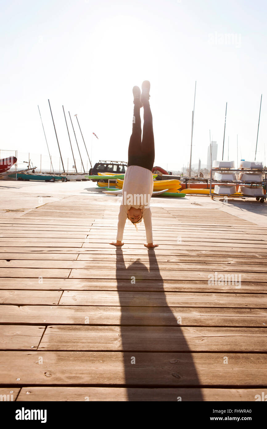 Girl doing a handstand hi-res stock photography and images - Alamy