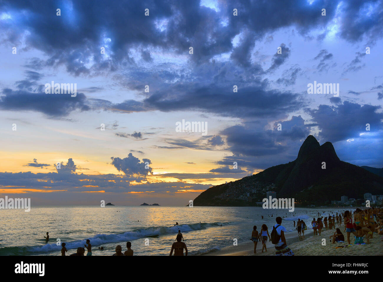 Bathers on Ipanema beach at sunset Stock Photo - Alamy