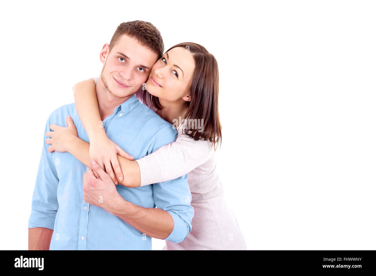 Beautiful young couple a man and a woman. They are holding hands ...