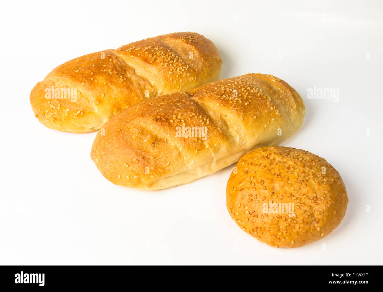 whole wheat two breads and bun on white background Stock Photo - Alamy