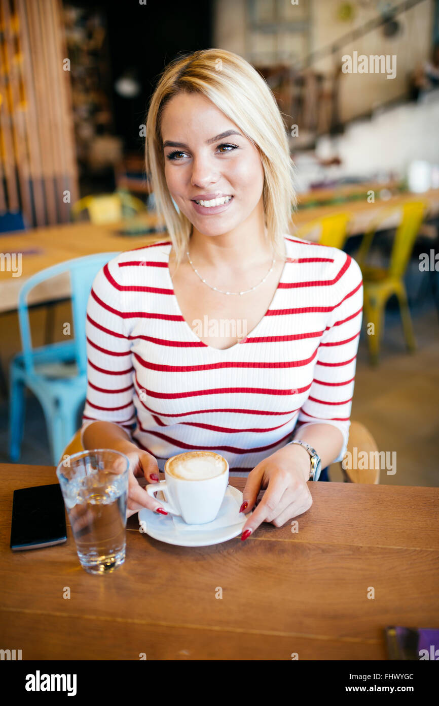 Nice girl sitting in cafe hi-res stock photography and images - Alamy