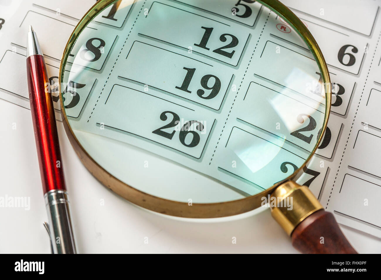 Magnifying calendar hi-res stock photography and images - Alamy
