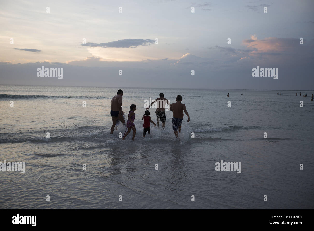 Bathers on the Beach Great for sunset Stock Photo - Alamy