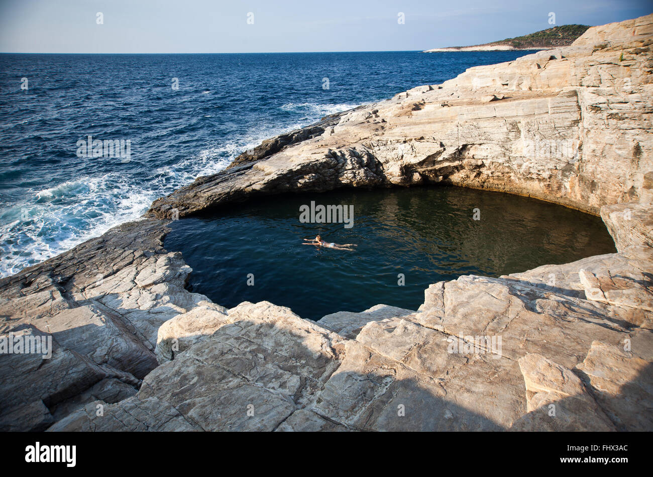 Top view of woman swimming in natural sea water pool Stock Photo - Alamy