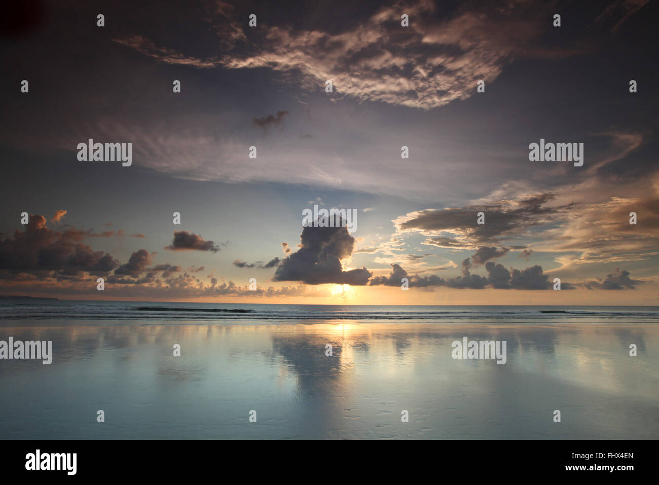 Radiant sea beach sunset on Bali Stock Photo - Alamy