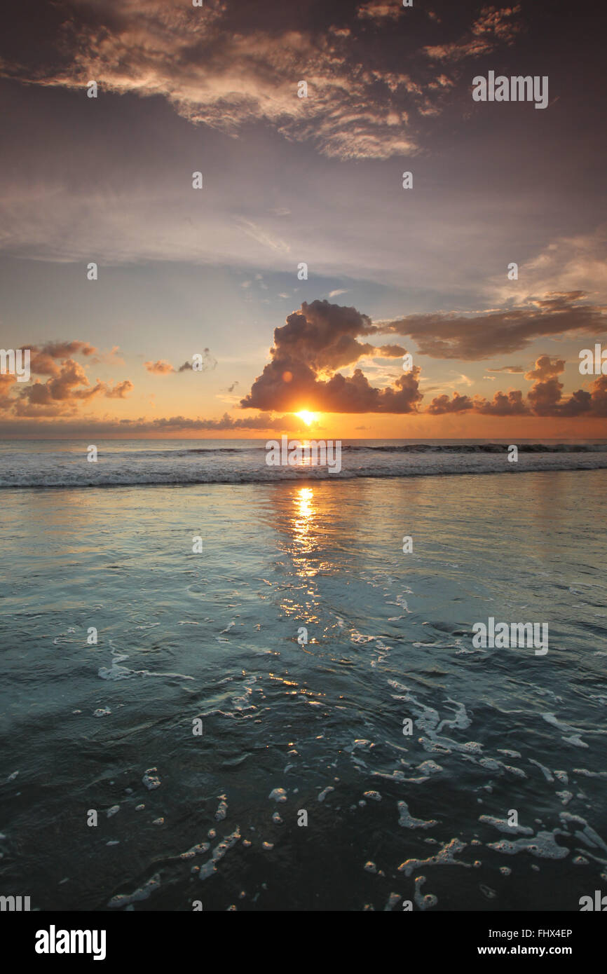 Radiant sea beach sunset on Bali Stock Photo - Alamy