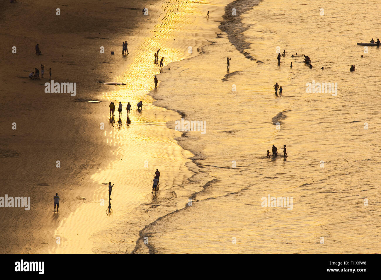 Bathers at Iracema Beach at dusk Stock Photo - Alamy