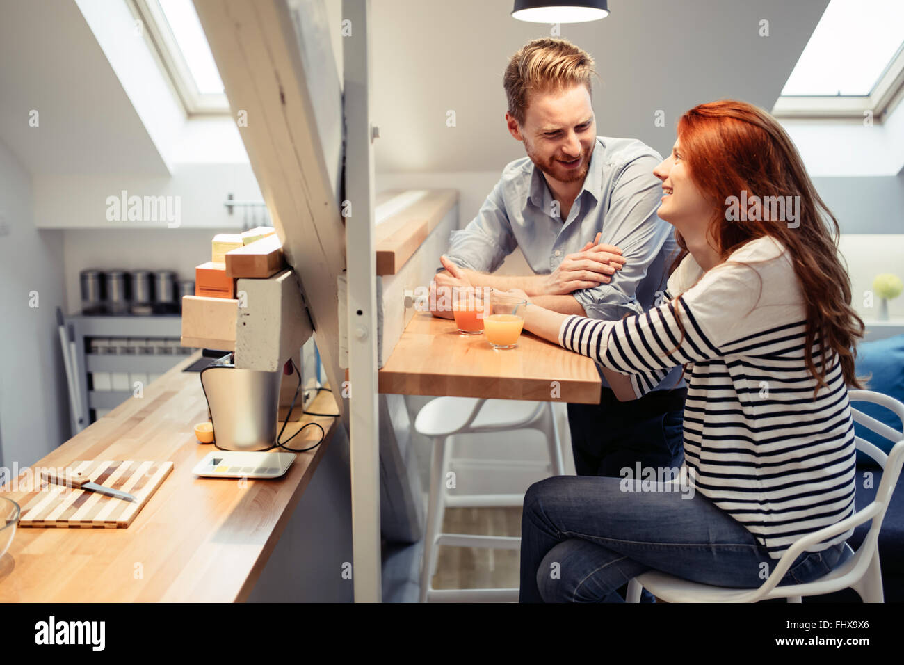 Couple in love talking smiling at home while being truly happy Stock ...