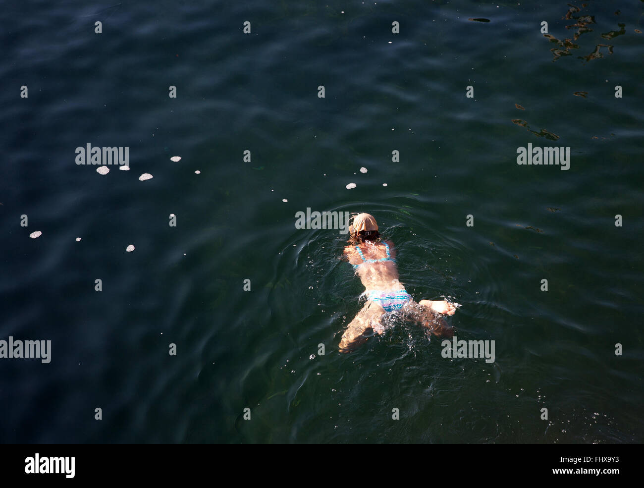Top view of woman swimming in natural sea water pool Stock Photo - Alamy