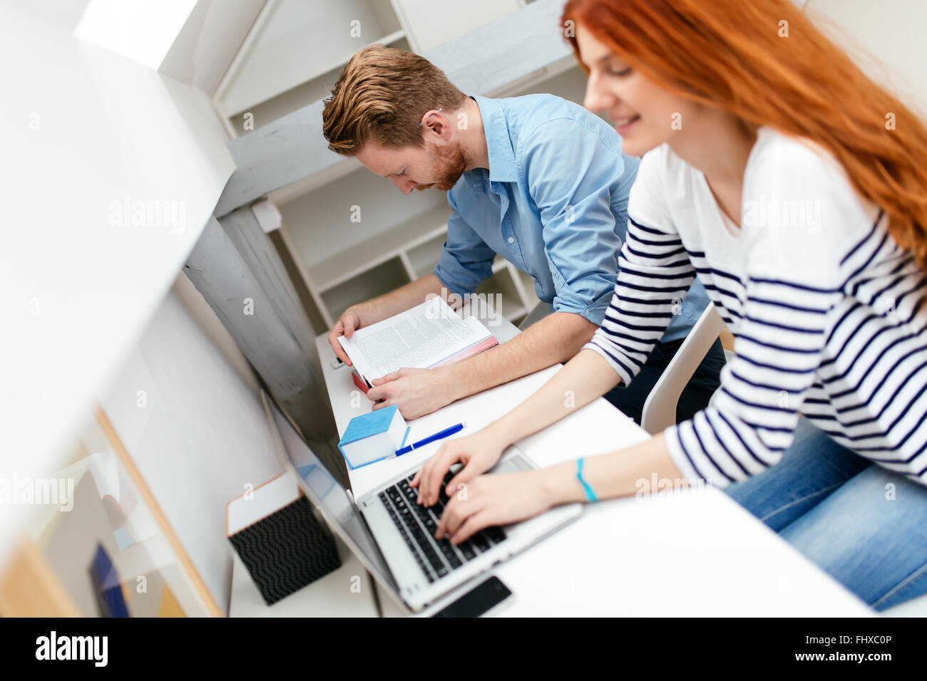 Husband and wife working from home on laptop Stock Photo - Alamy