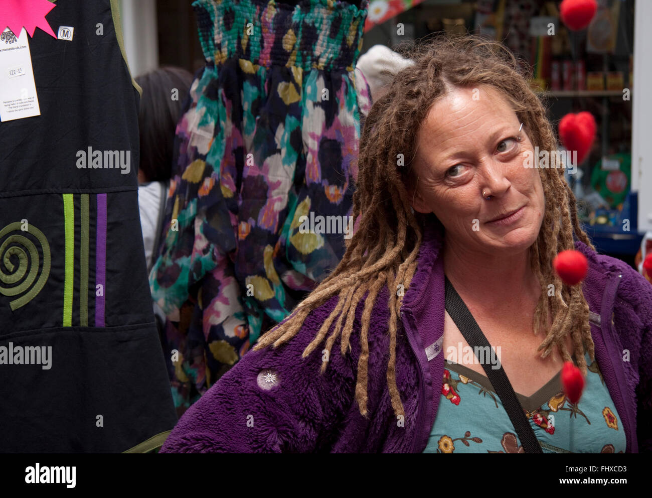 Woman with coy expression hi-res stock photography and images - Alamy