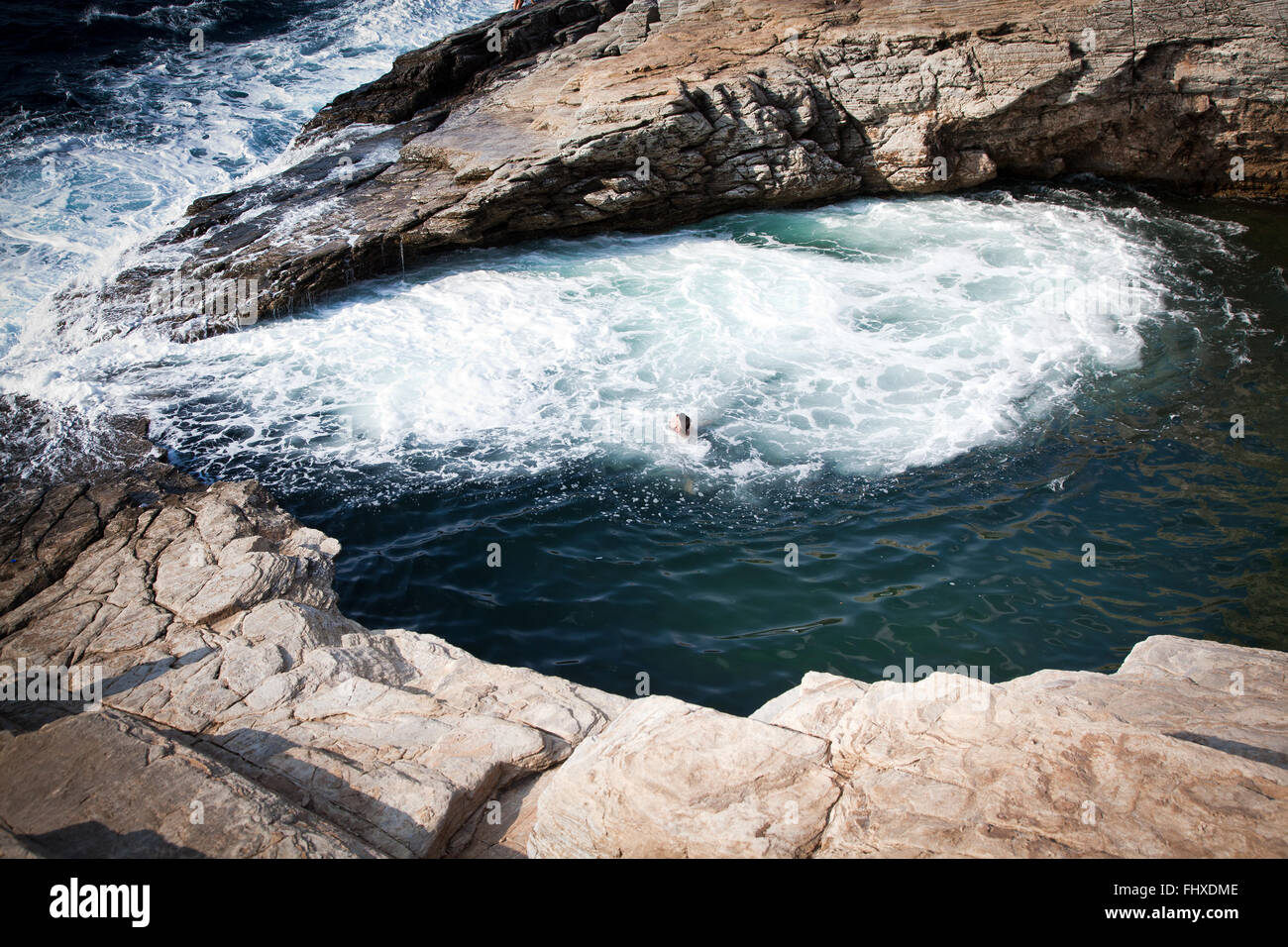 Top view of woman swimming in natural sea water pool Stock Photo - Alamy