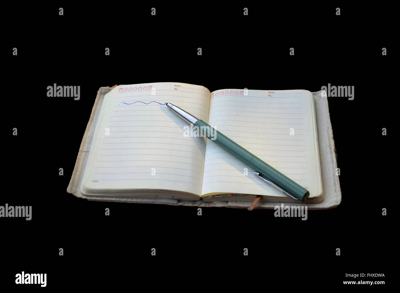 Pen and note book with black background Stock Photo - Alamy