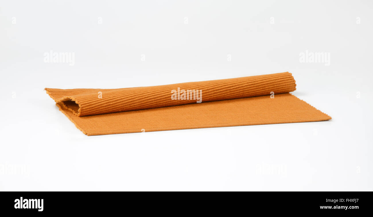 Folded brown cloth place mat Stock Photo - Alamy
