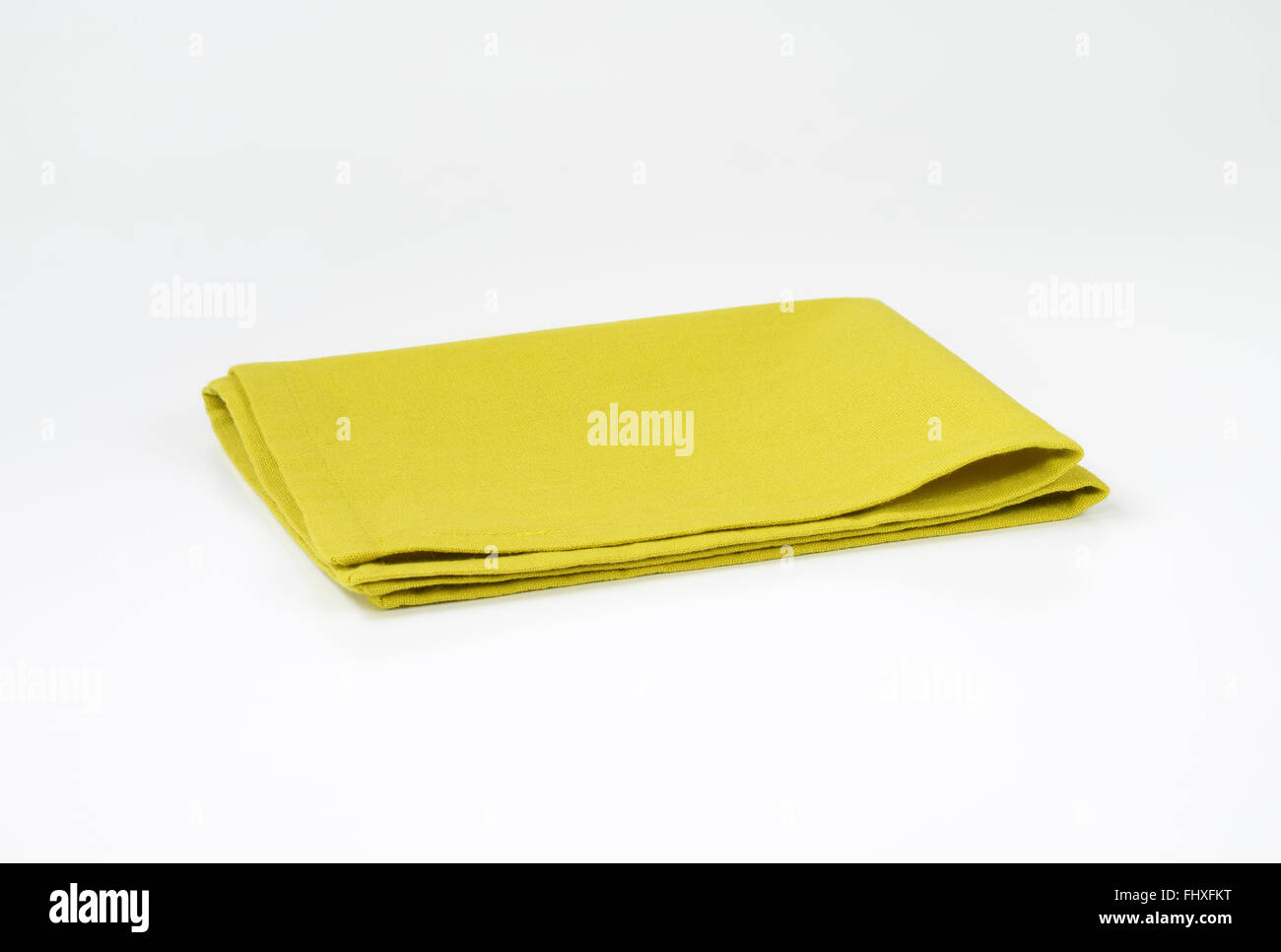 Folded green cloth napkin on white background Stock Photo - Alamy