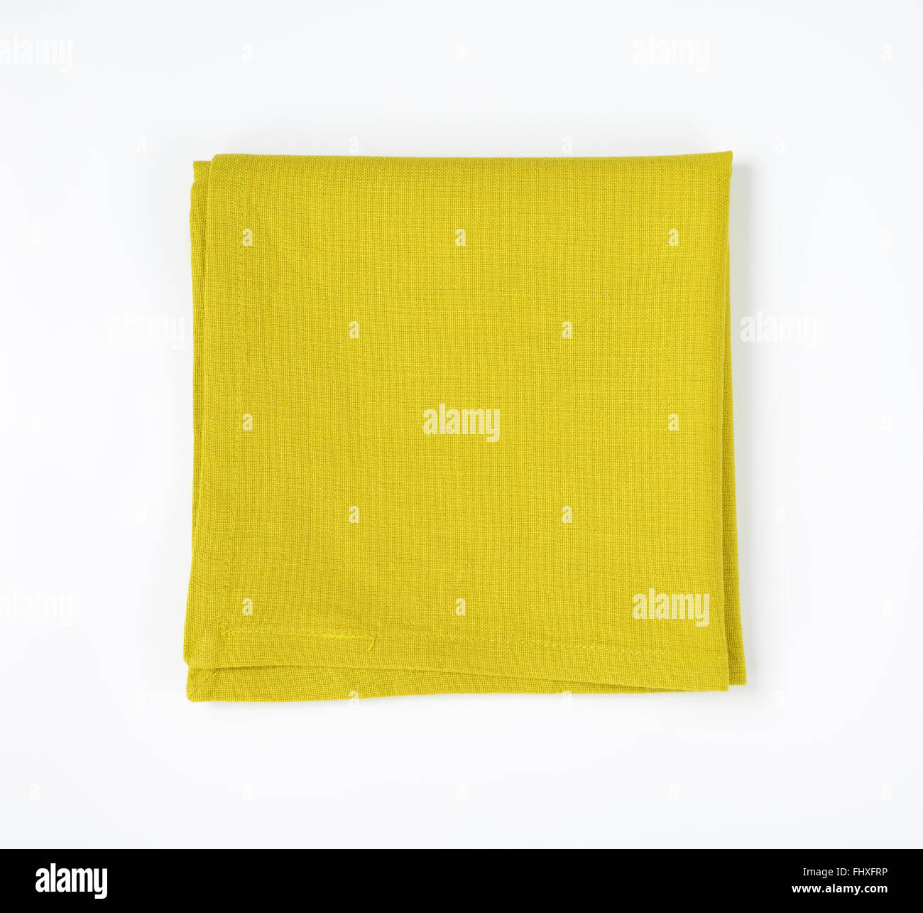 Folded green cloth napkin on white background Stock Photo - Alamy
