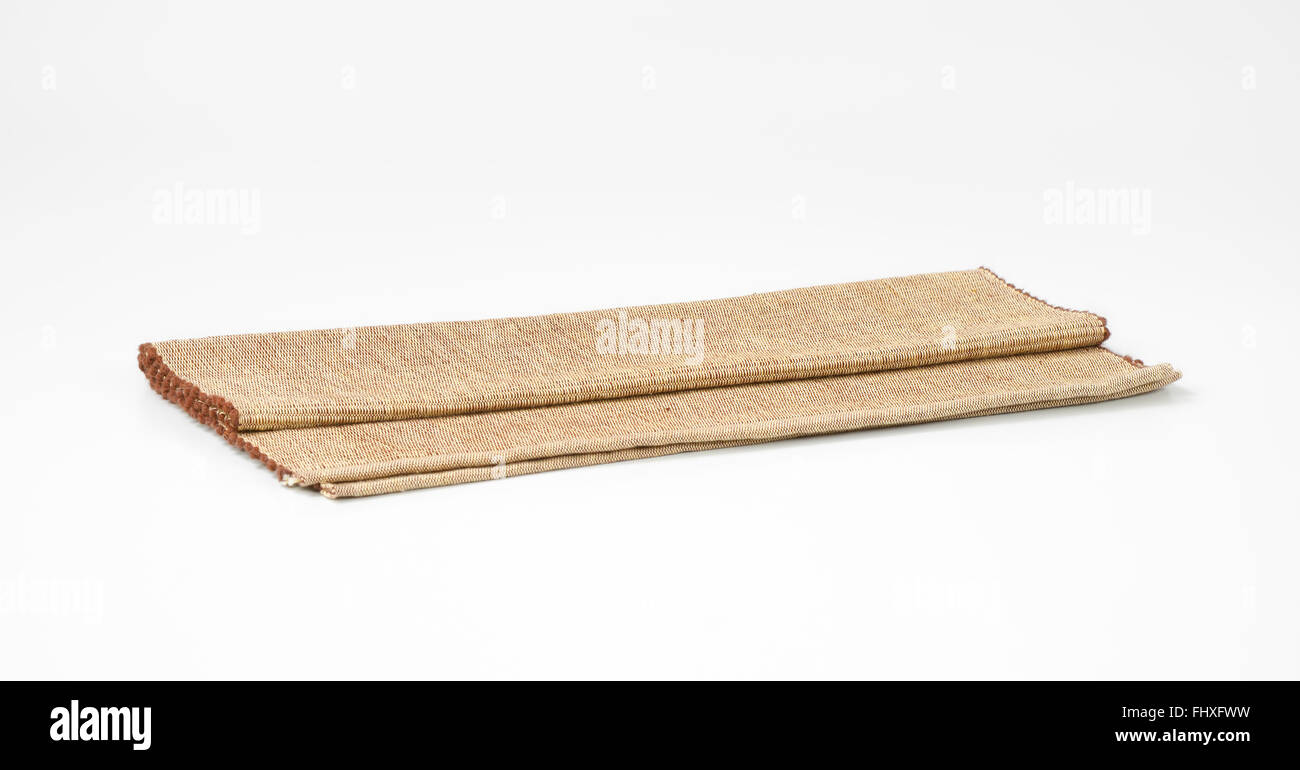 folded cotton yarn place mat on white background Stock Photo - Alamy