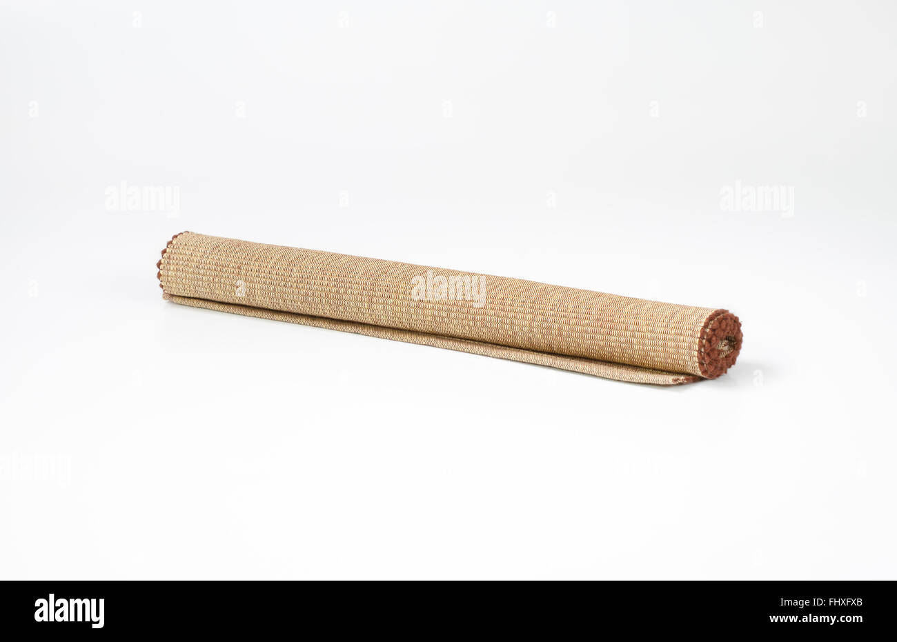 Rolled cotton place mat on white background Stock Photo - Alamy