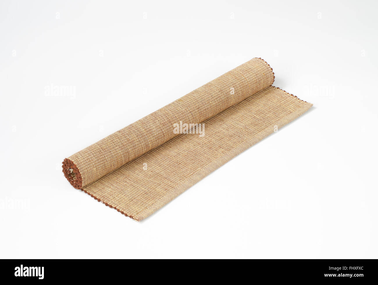 Rolled cotton place mat on white background Stock Photo - Alamy