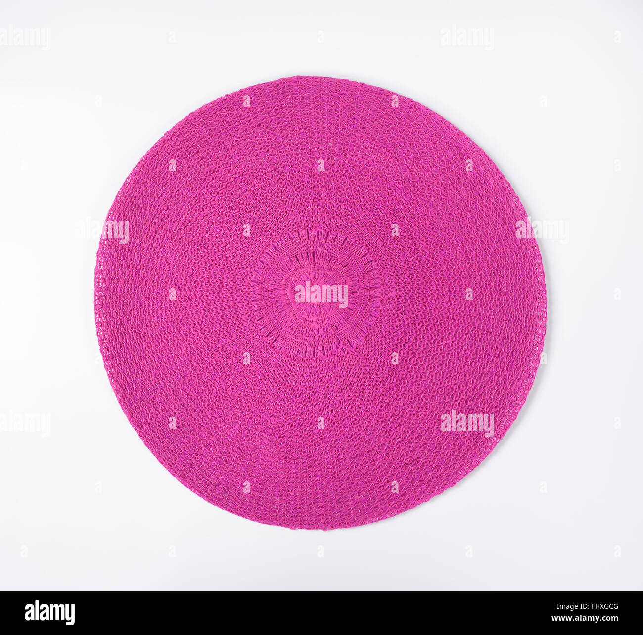 Round purple table mat on white background Stock Photo - Alamy