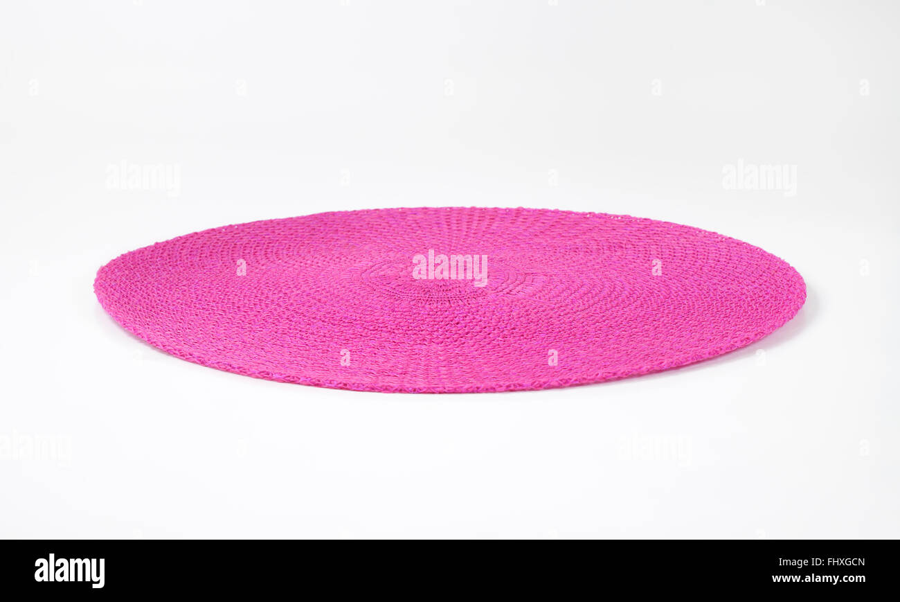 Round purple table mat on white background Stock Photo - Alamy