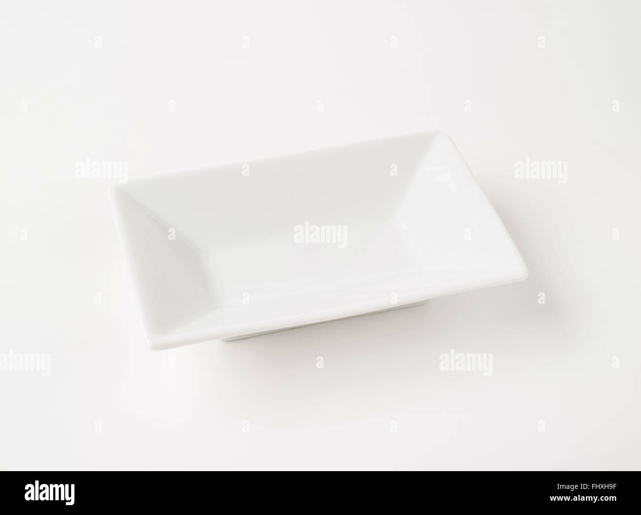 small white dish for appetizers, snacks or sauces Stock Photo - Alamy