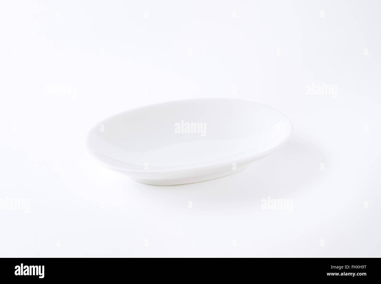 white oval bowl on white background Stock Photo - Alamy