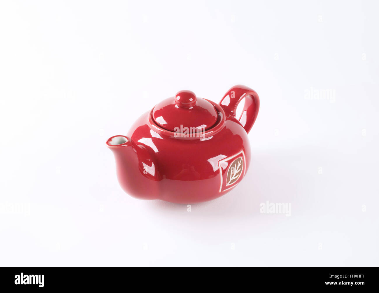 red tea jug on white background Stock Photo - Alamy