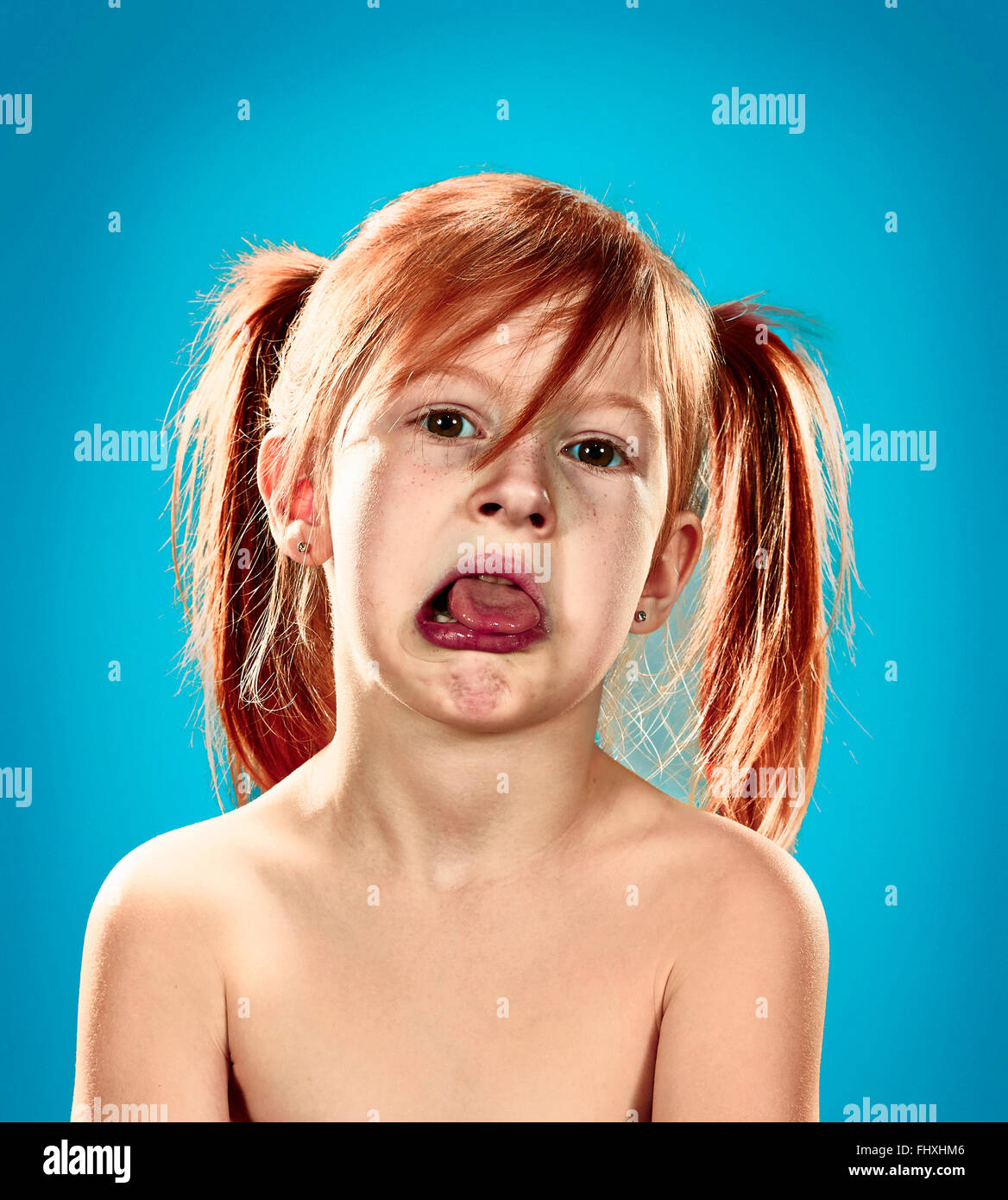 The beautiful portrait of displeased and disaffected little girl on ...