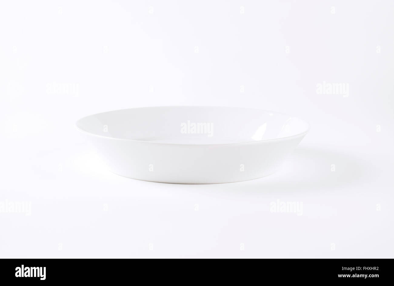 empty white bowl on white background Stock Photo - Alamy