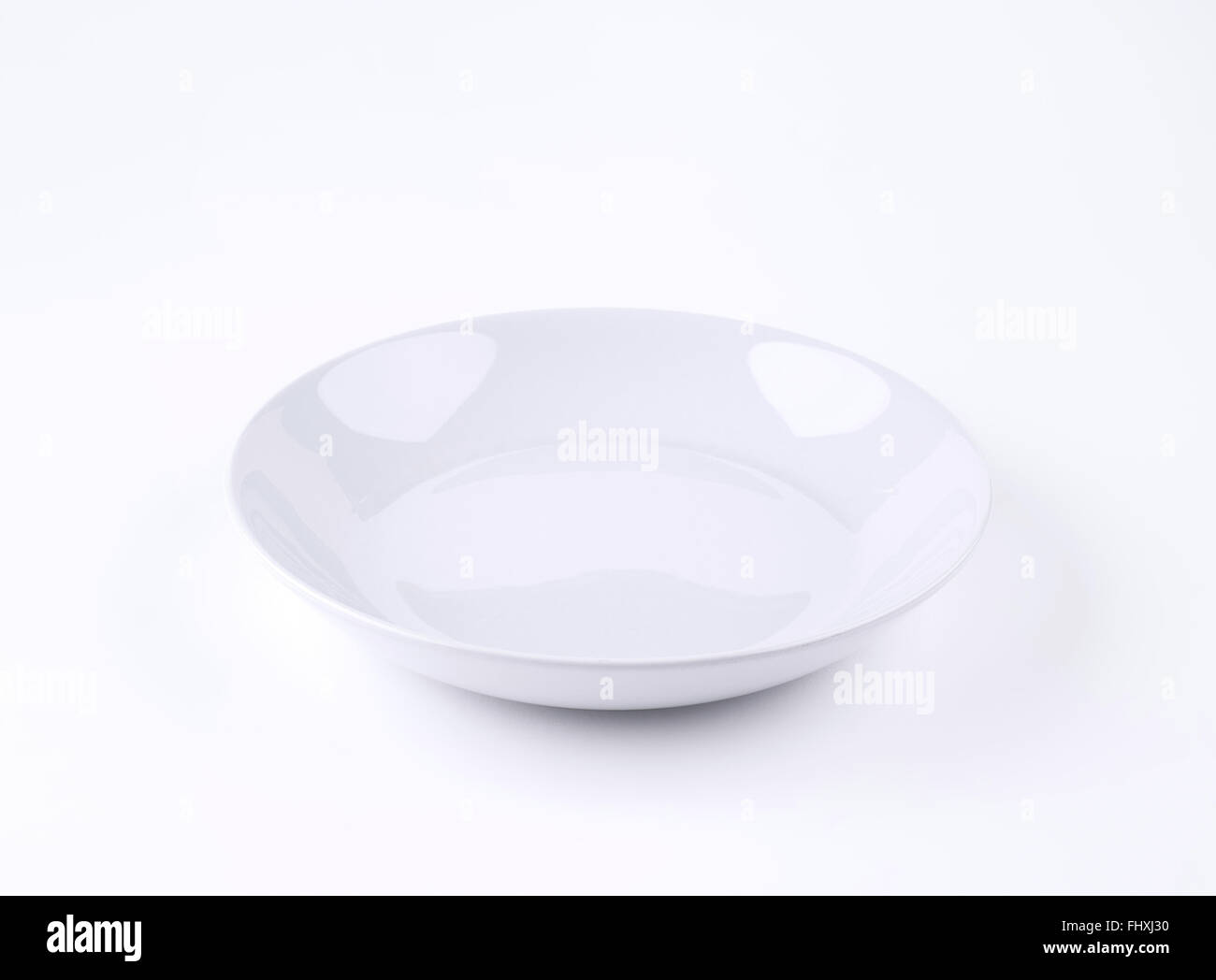 grey soup plate on white background Stock Photo - Alamy