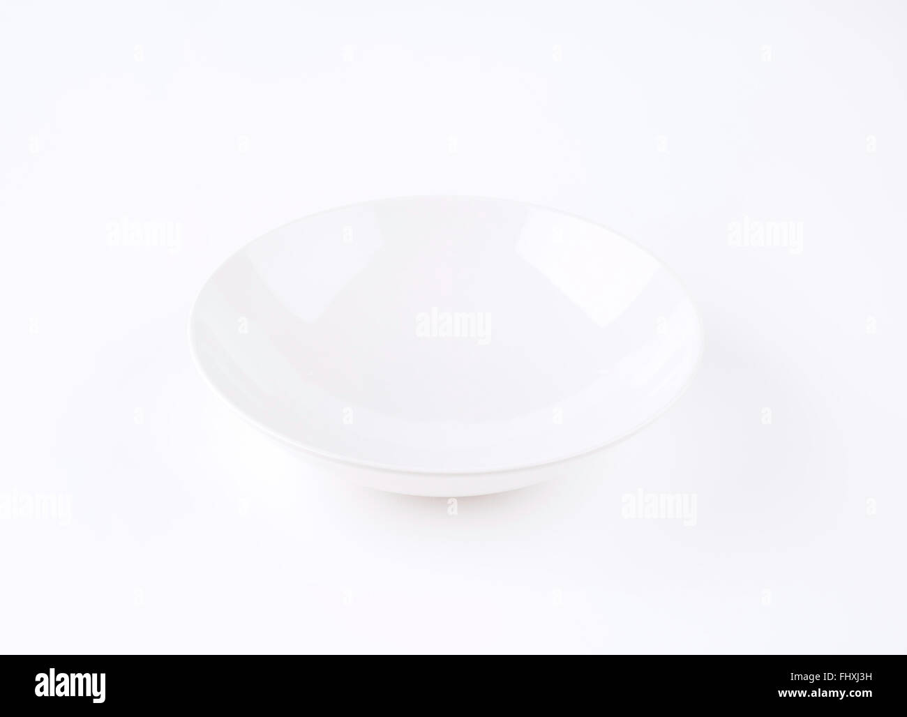 white soup plate on white background Stock Photo - Alamy