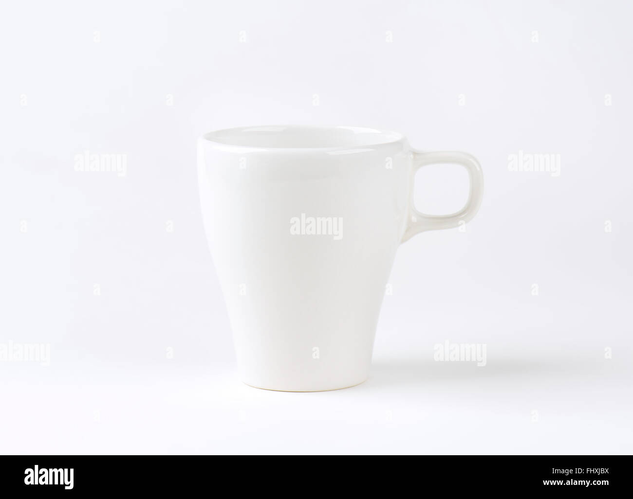 empty white mug on white background Stock Photo - Alamy