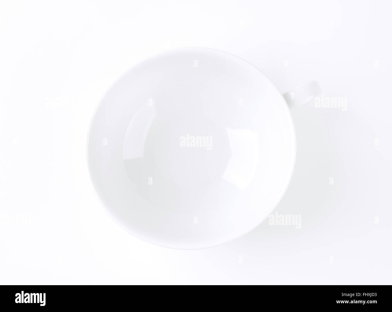 empty tea cup on white background Stock Photo - Alamy