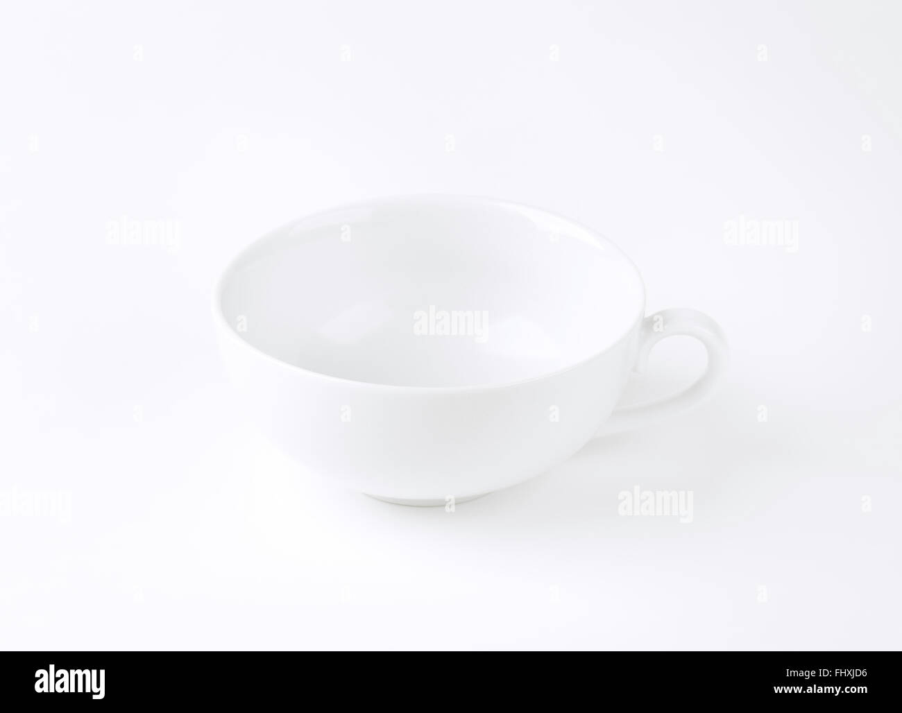 empty tea cup on white background Stock Photo - Alamy