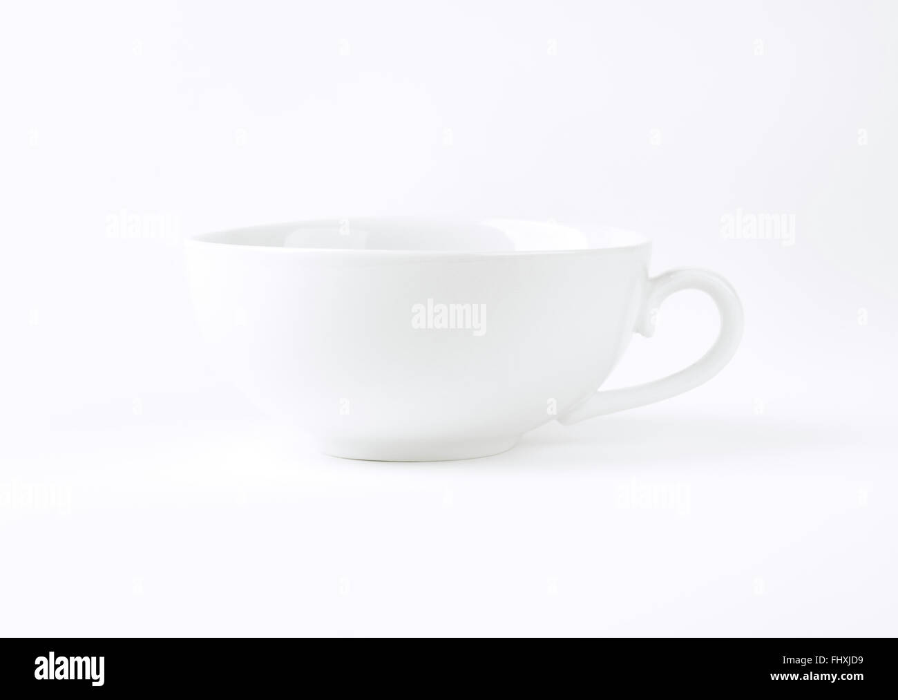 empty tea cup on white background Stock Photo - Alamy
