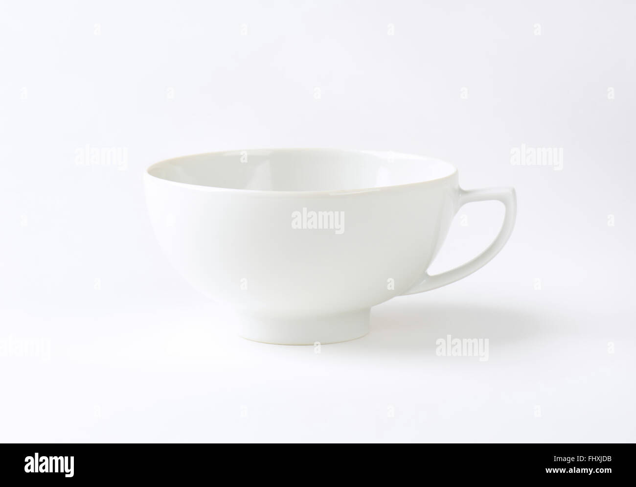 empty tea cup on white background Stock Photo - Alamy