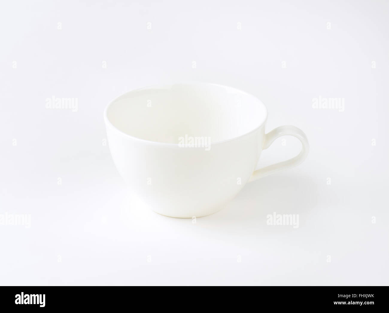 empty tea cup on white background Stock Photo - Alamy