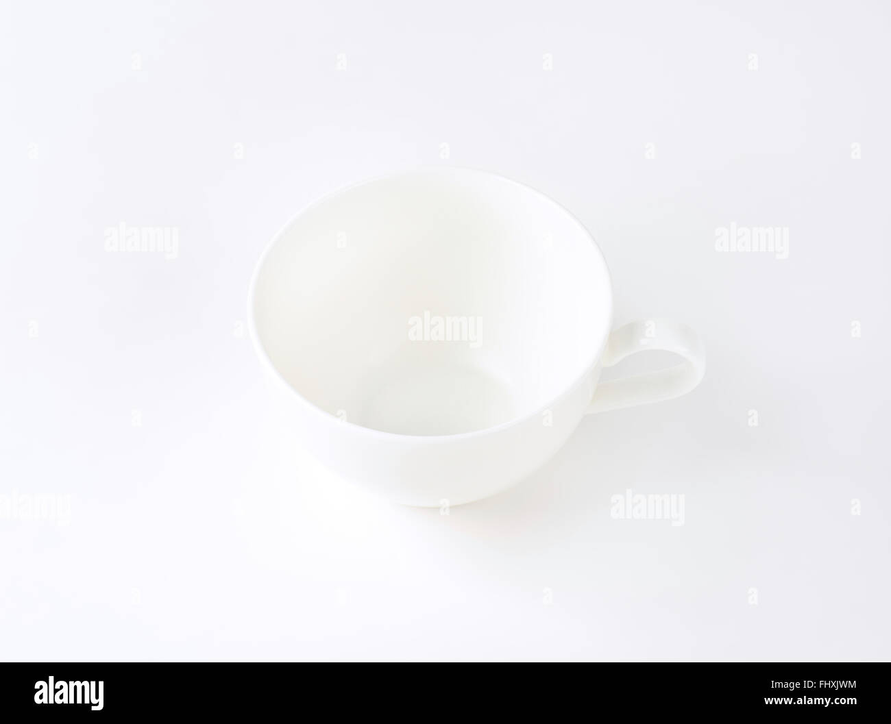 empty tea cup on white background Stock Photo - Alamy