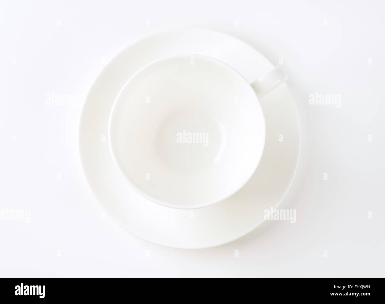 empty tea cup and saucer on white background Stock Photo - Alamy