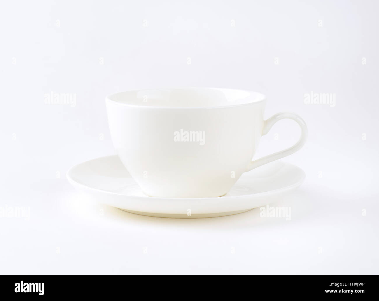 empty tea cup and saucer on white background Stock Photo - Alamy