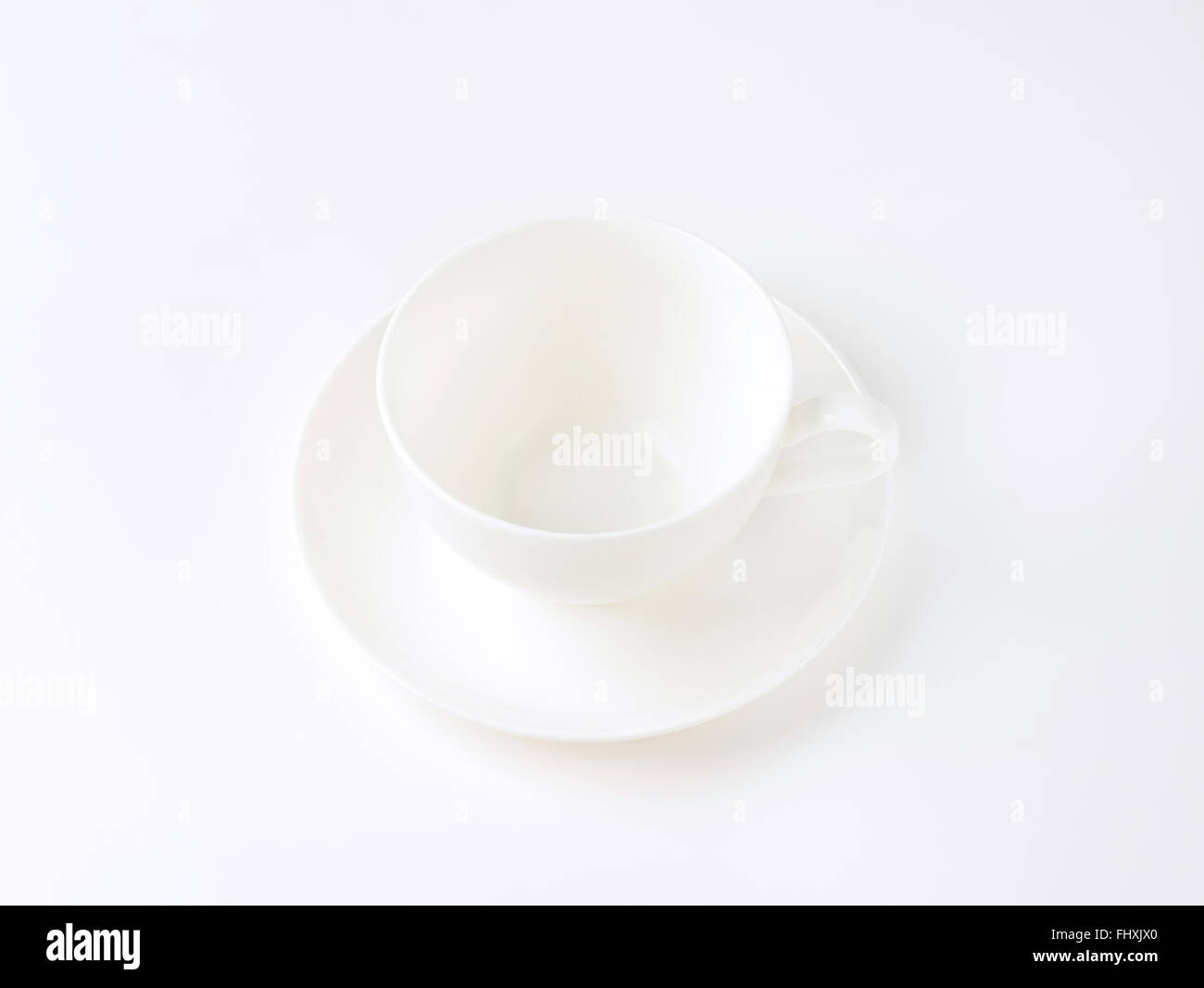 empty tea cup and saucer on white background Stock Photo - Alamy