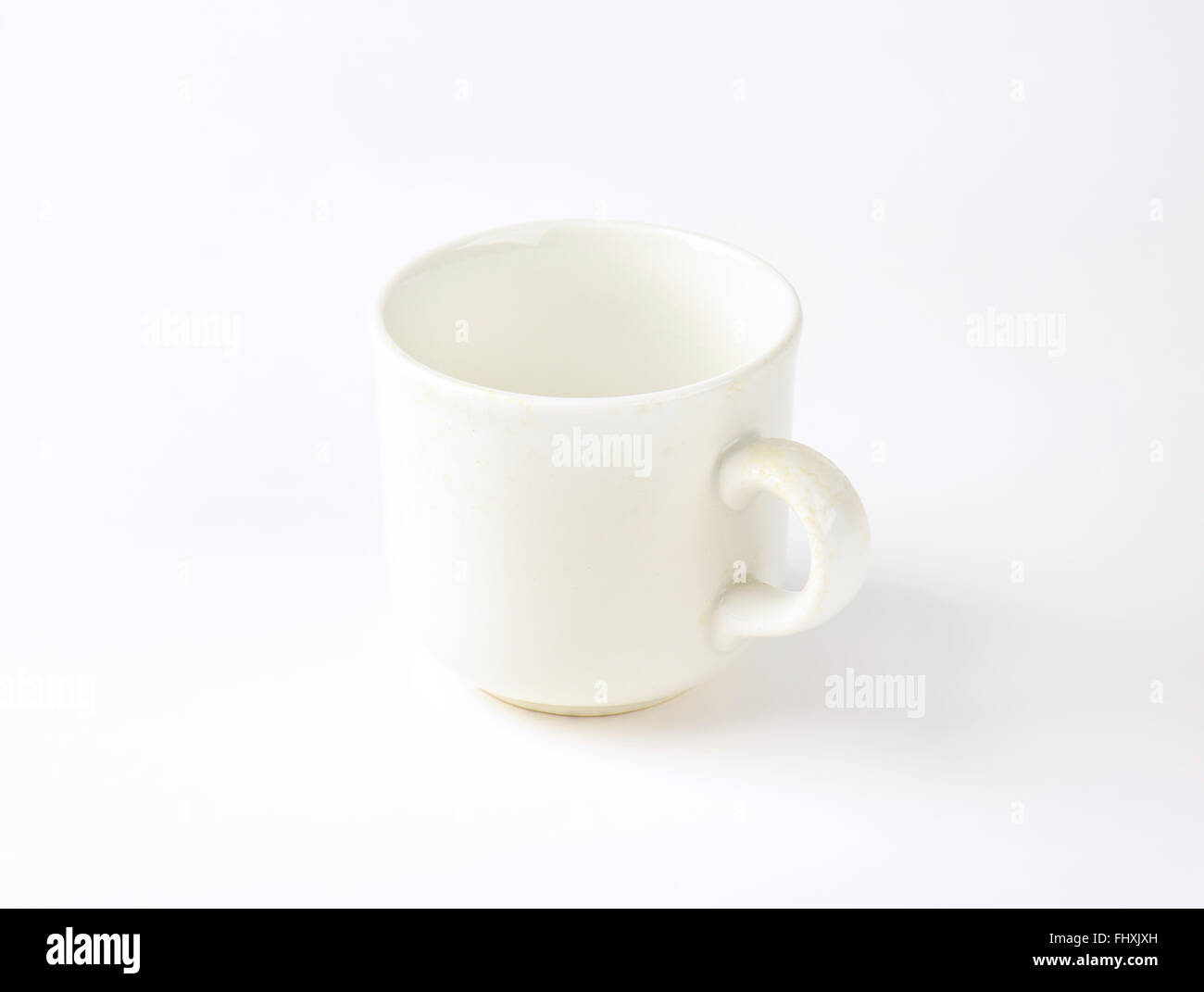 empty white mug on white background Stock Photo - Alamy