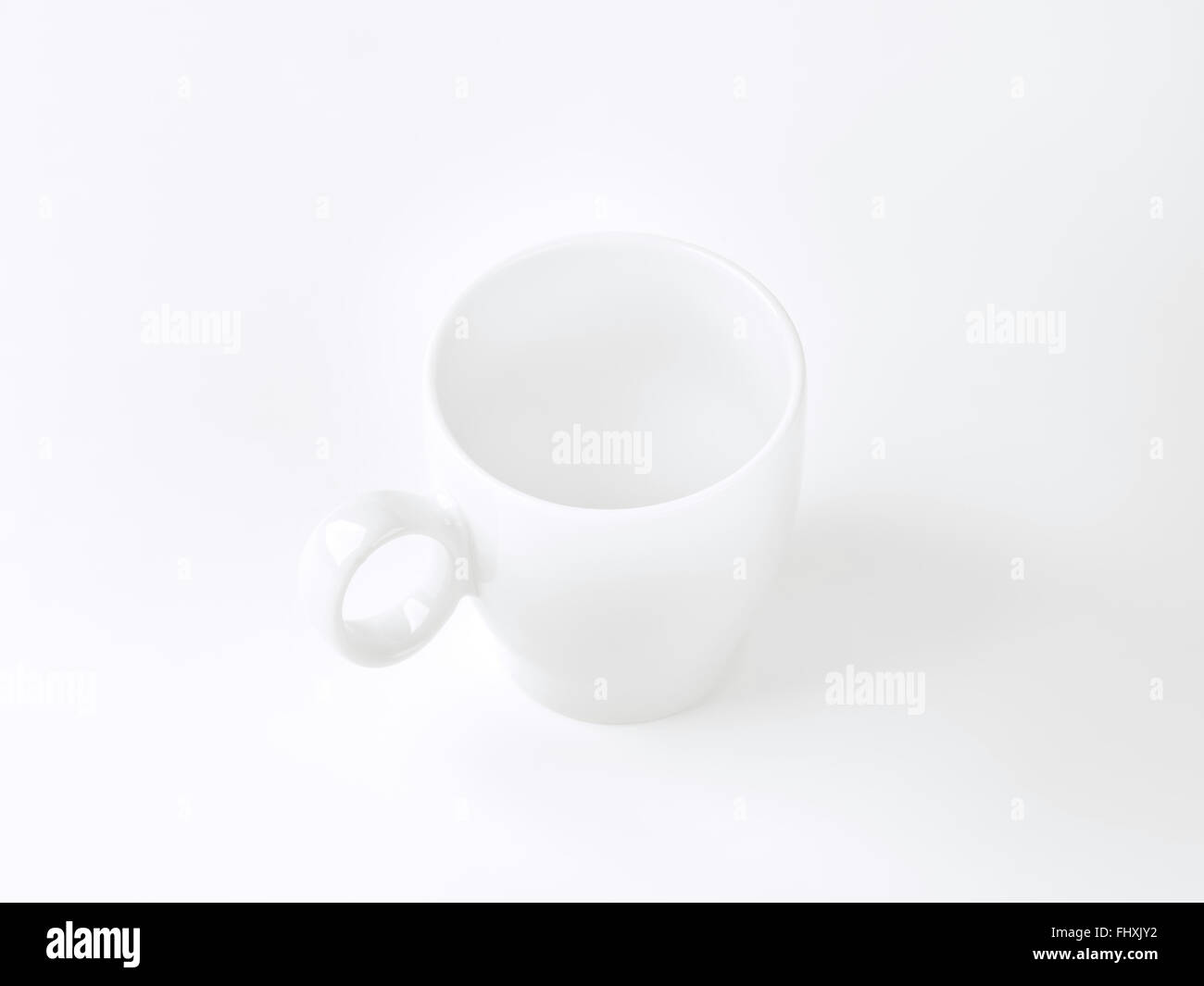 empty white mug on white background Stock Photo - Alamy
