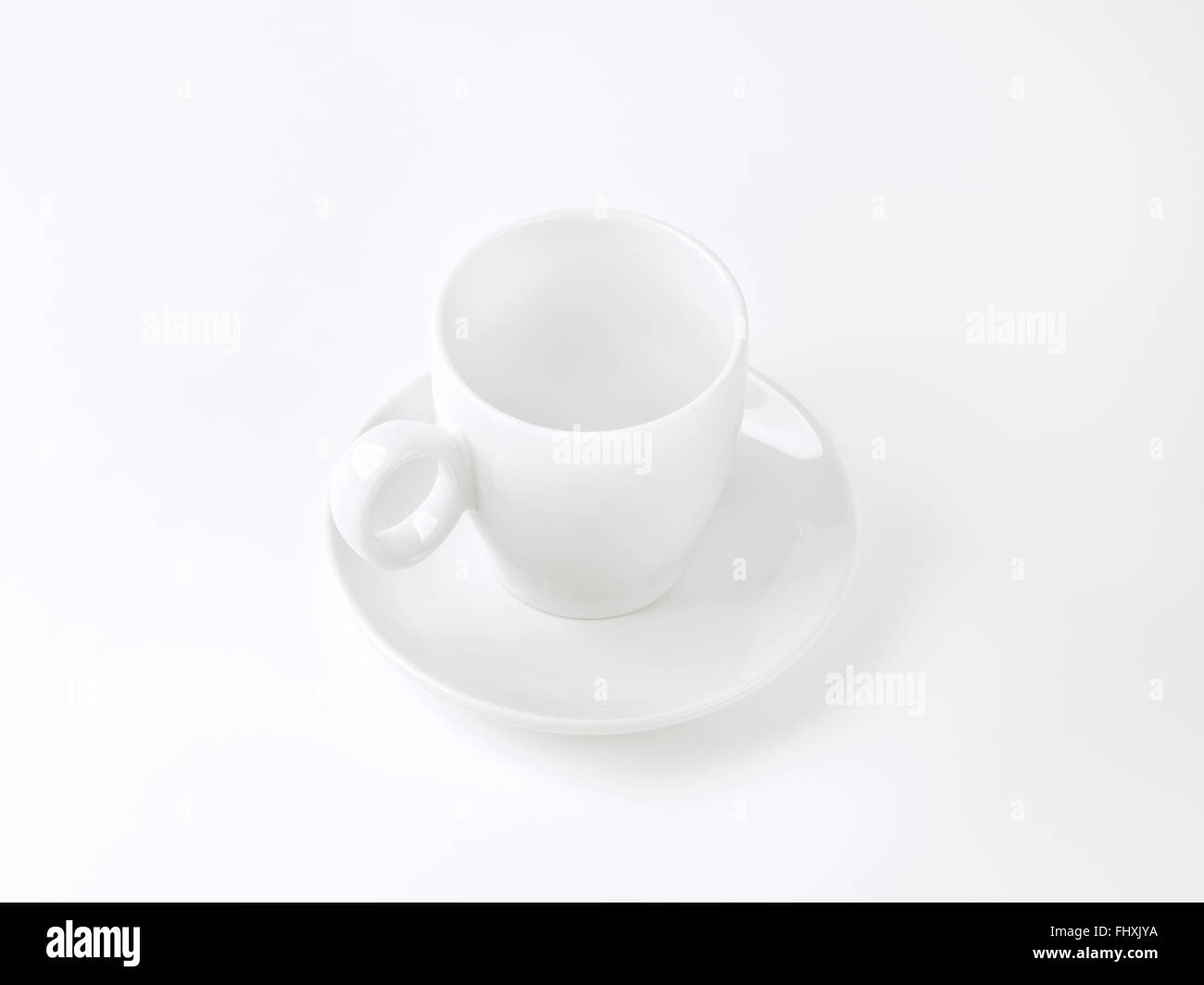 empty tea cup and saucer on white background Stock Photo - Alamy