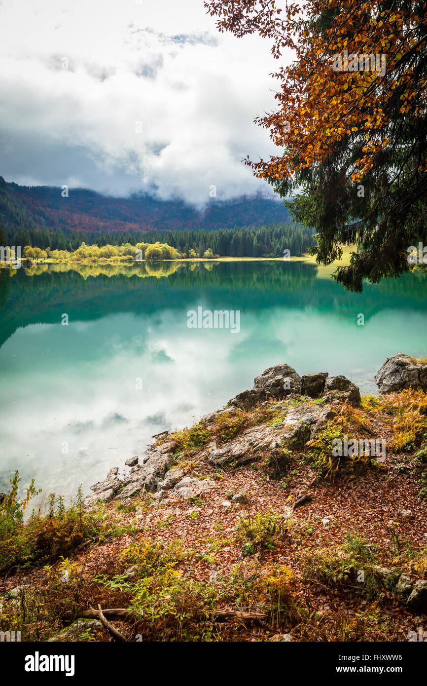 Fall in the italian alps in a misty day Stock Photo - Alamy