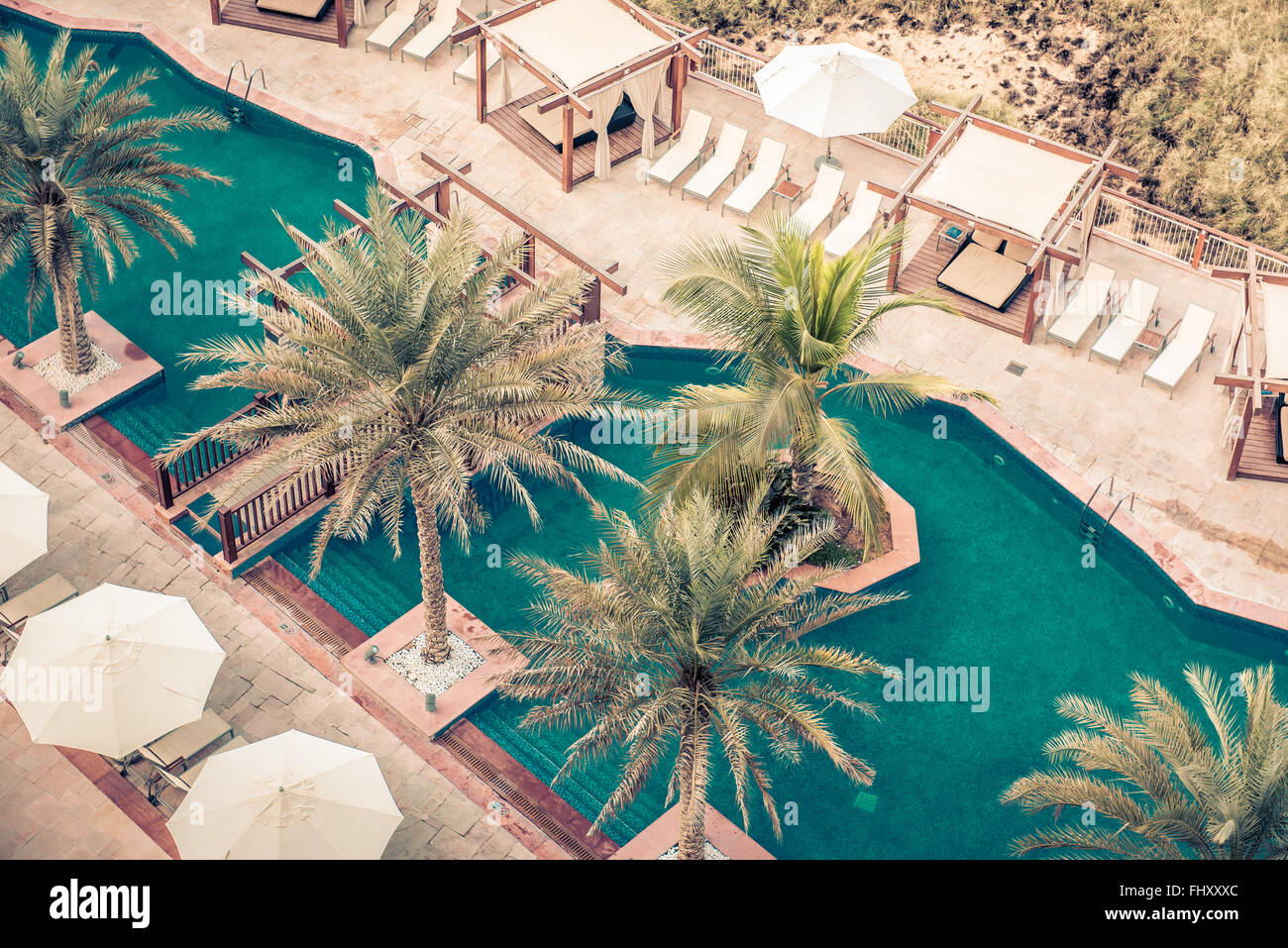 Hotel Poolside with Parasols and Palms. Top view shot Stock Photo - Alamy
