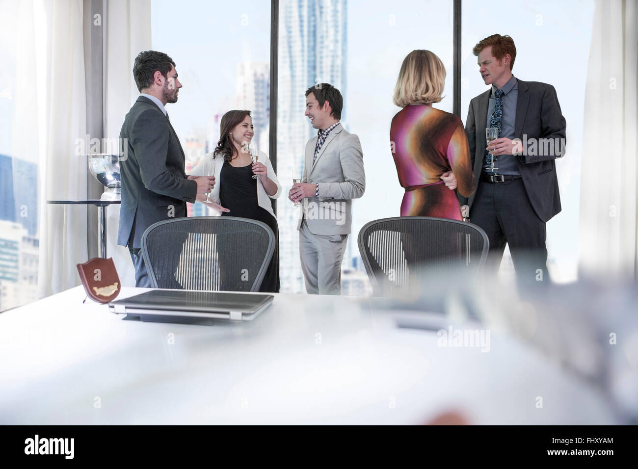 Successful business people having a work party Stock Photo - Alamy