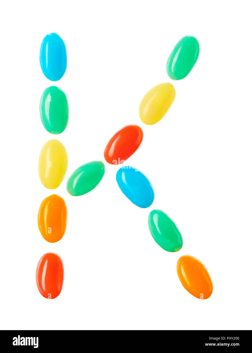K letter made of multicolored candies isolated on white background ...