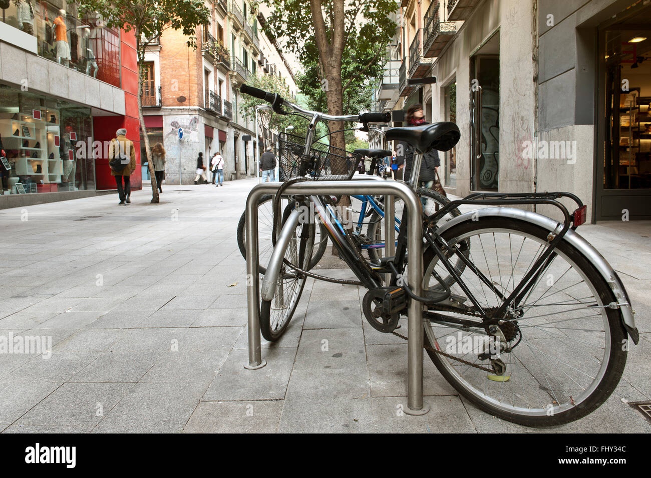 Locked bikes on an urban street. Horizontal view Stock Photo - Alamy